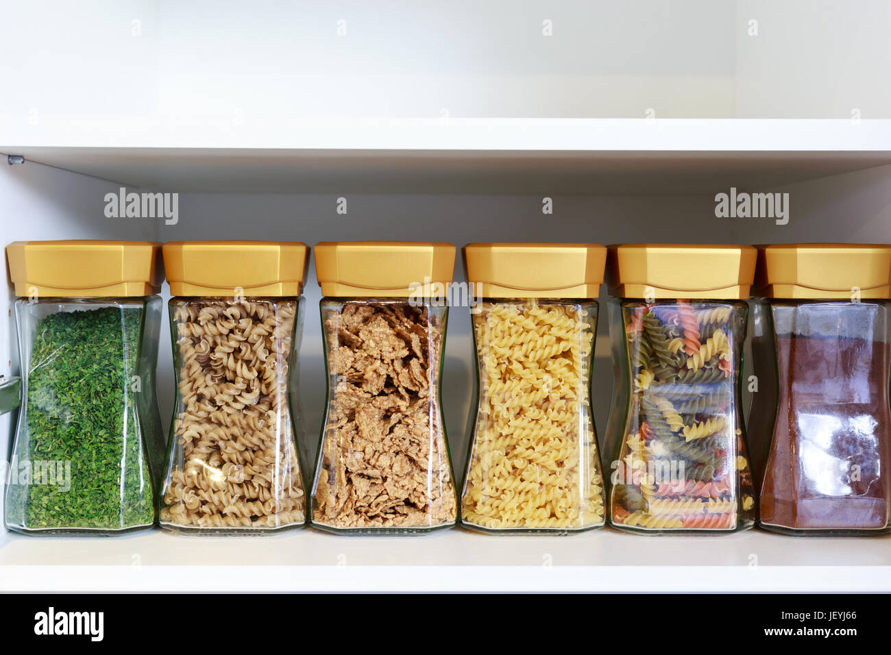 Modern kitchen countertop with food ingredients. Top view of drawers ...