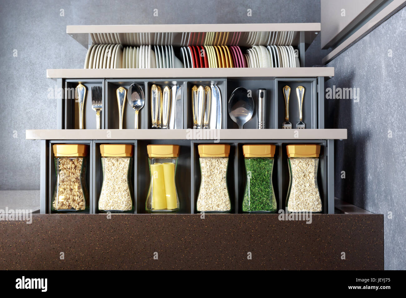 Modern kitchen countertop with food ingredients. Top view of drawers ...