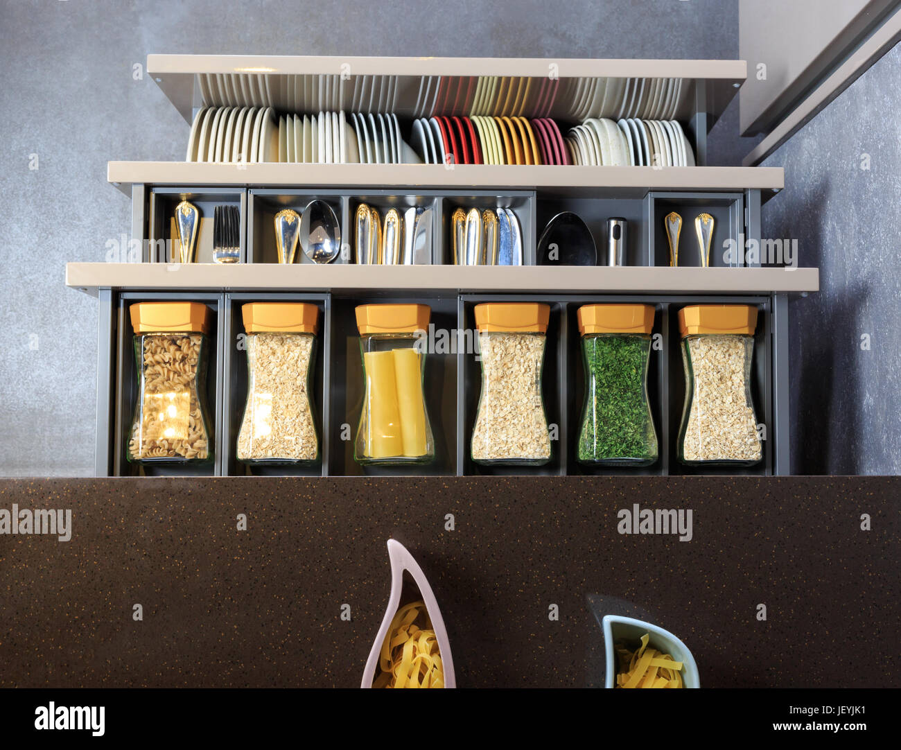 Modern kitchen countertop with food ingredients. Top view of drawers ...