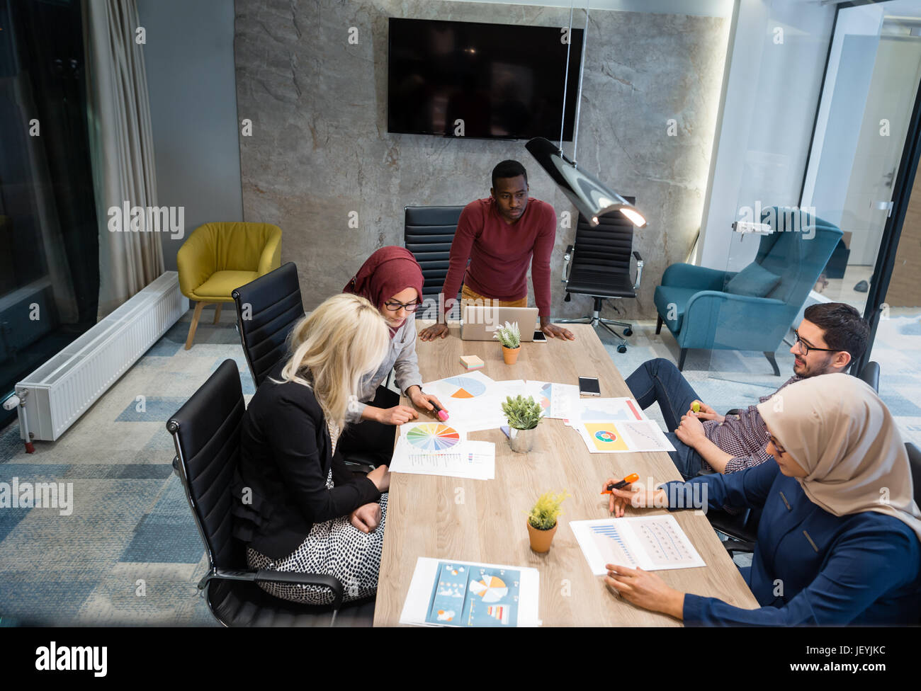 Multi-Cultural Office Staff Sitting Having Meeting Together Stock Photo ...