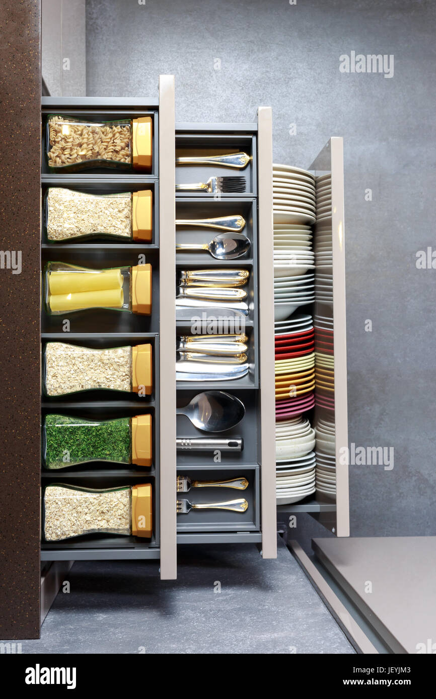 Modern kitchen countertop with food ingredients. Top view of drawers ...