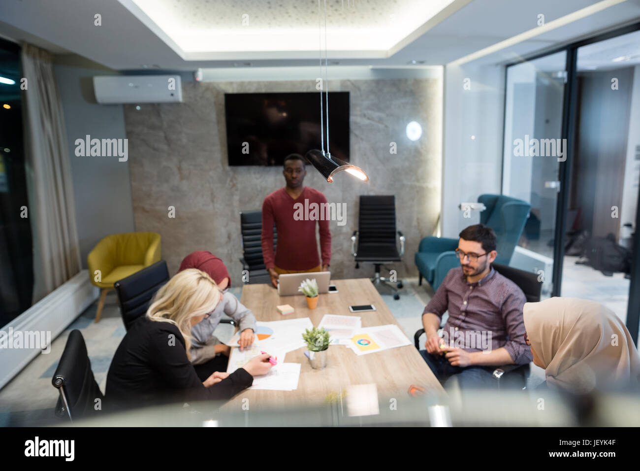 Multi-Cultural Office Staff Sitting Having Meeting Together Stock Photo ...