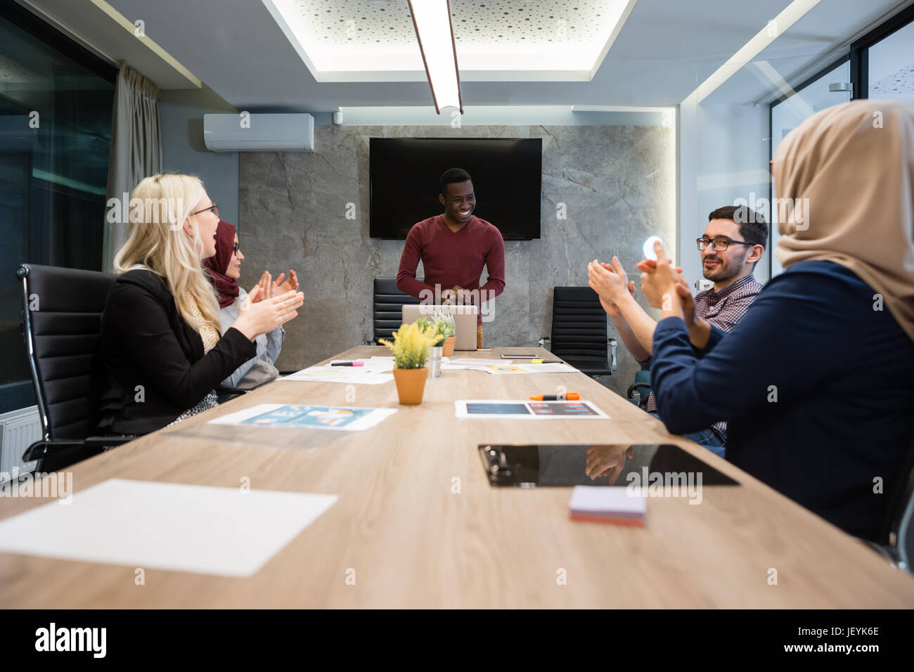 Multi-Cultural Office Staff Sitting Having Meeting Together Stock Photo ...