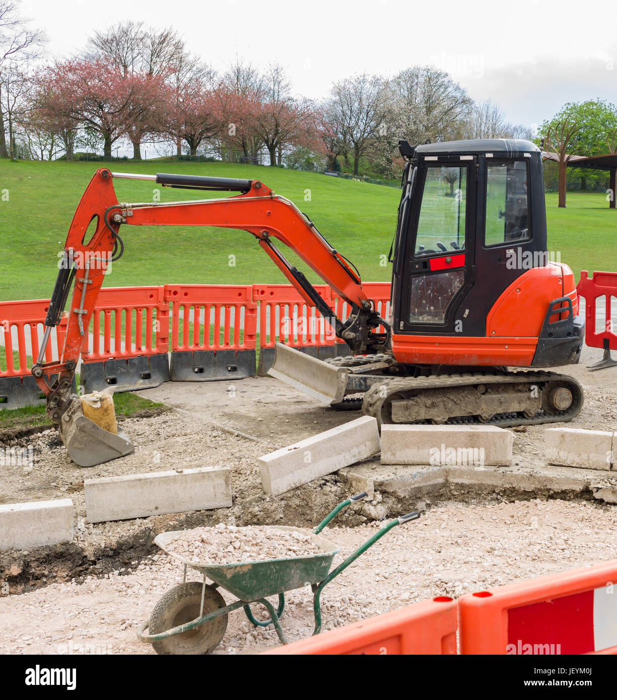 Red digger on construction site Stock Photo - Alamy