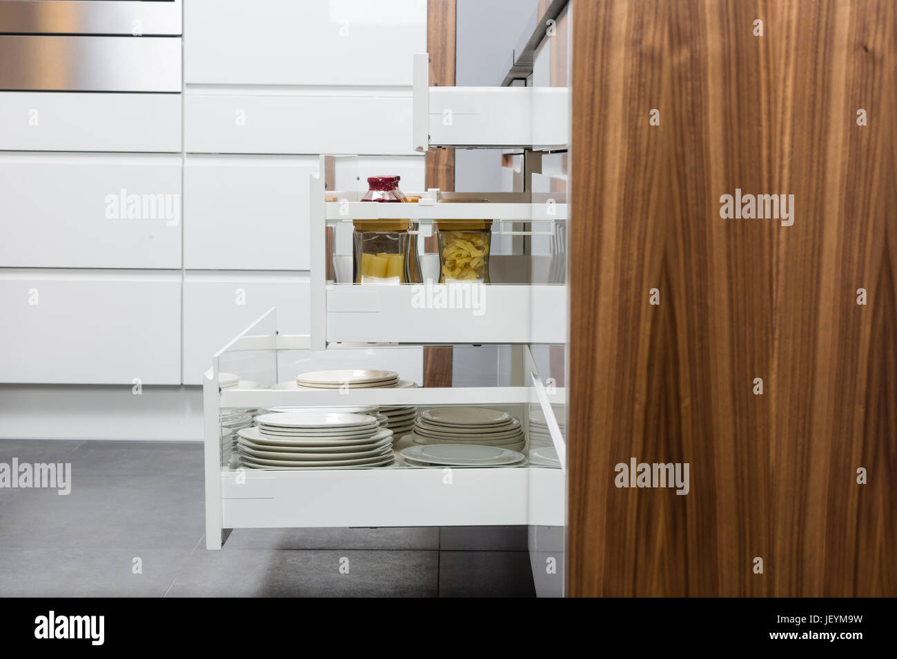 Side view of a spices and groceries organized in a modern kitchen ...