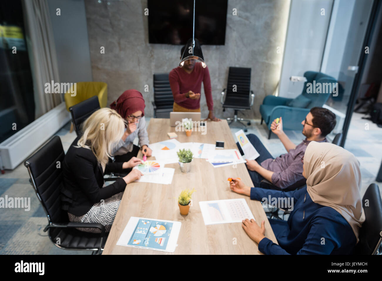 Multi-Cultural Office Staff Sitting Having Meeting Together Stock Photo ...