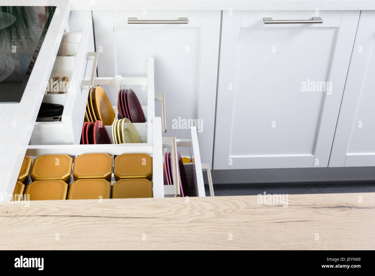 Side view of a spices and groceries organized in a modern kitchen ...