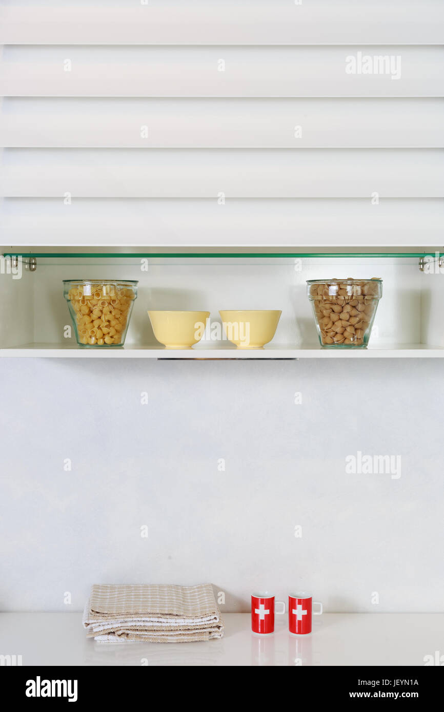 Food ingredients organized on a shelf on modern kitchen countertop ...