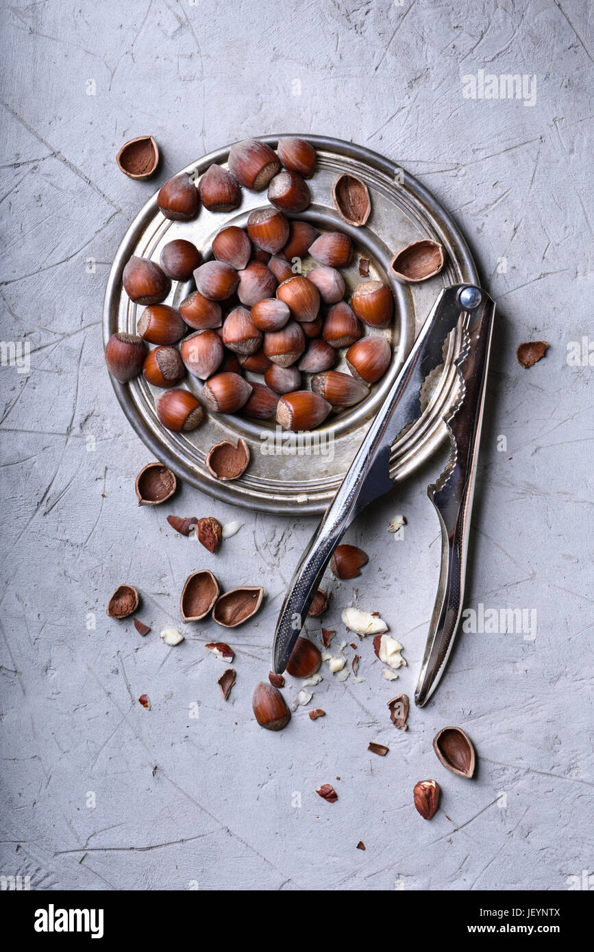 Hazelnuts with a nut cracker, healthy snack. Close up, top view Stock ...