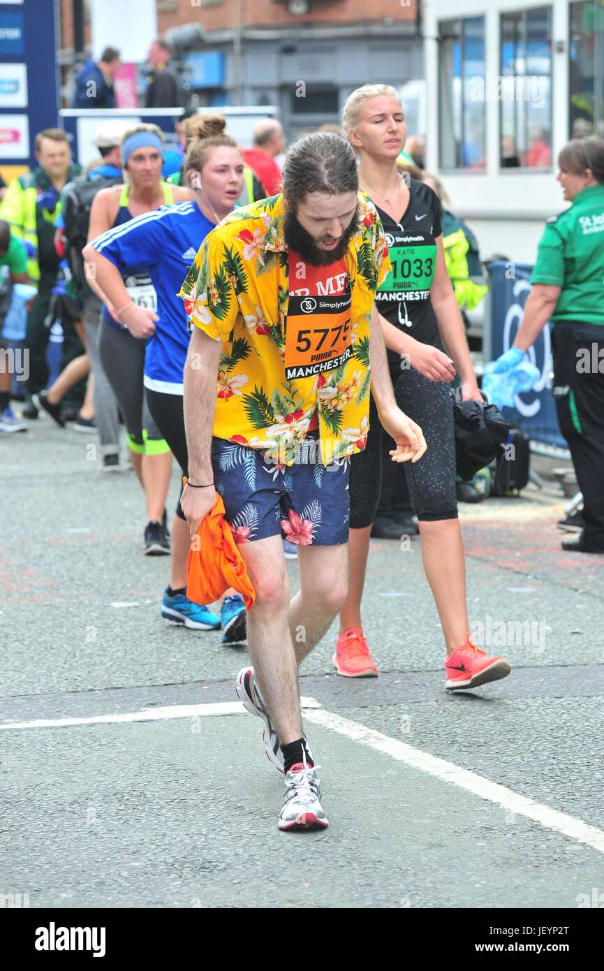 runner are seen finishing the great Manchester run, despite the ...