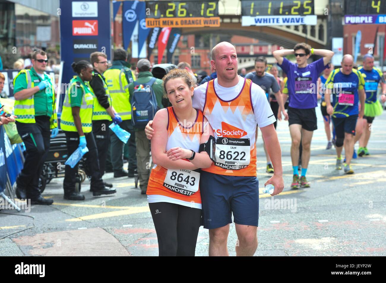 runner are seen finishing the great Manchester run, despite the ...
