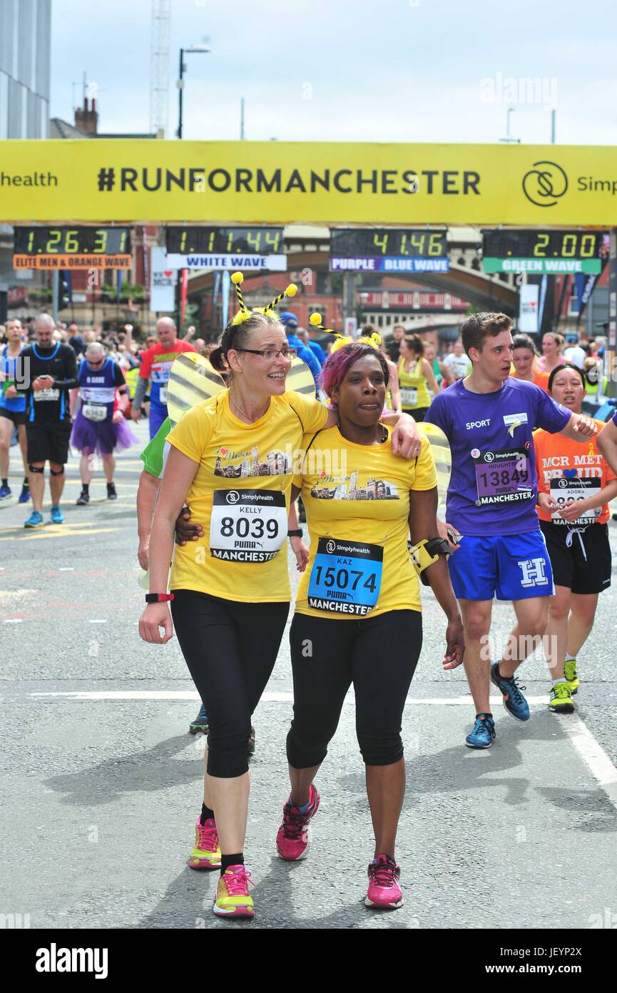 runner are seen finishing the great Manchester run, despite the ...