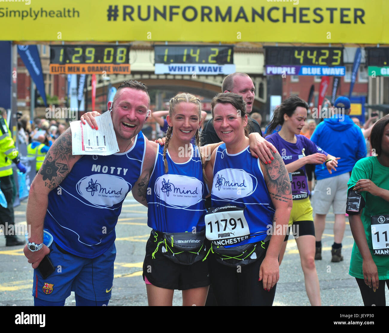 runner are seen finishing the great Manchester run, despite the ...