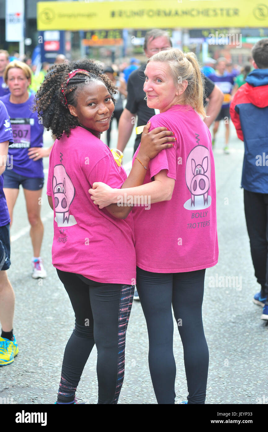 runner are seen finishing the great Manchester run, despite the ...