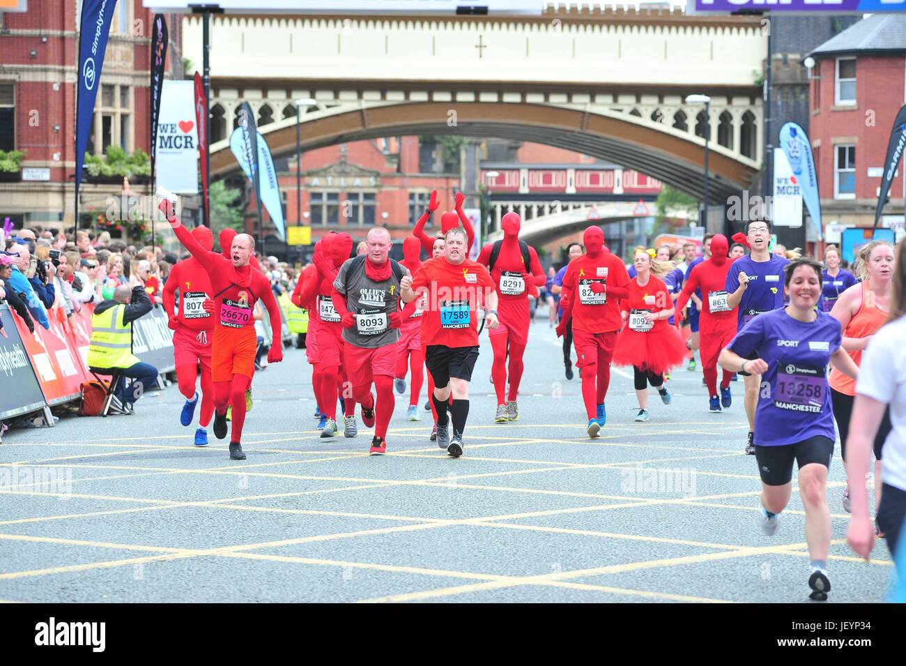 runner are seen finishing the great Manchester run, despite the ...