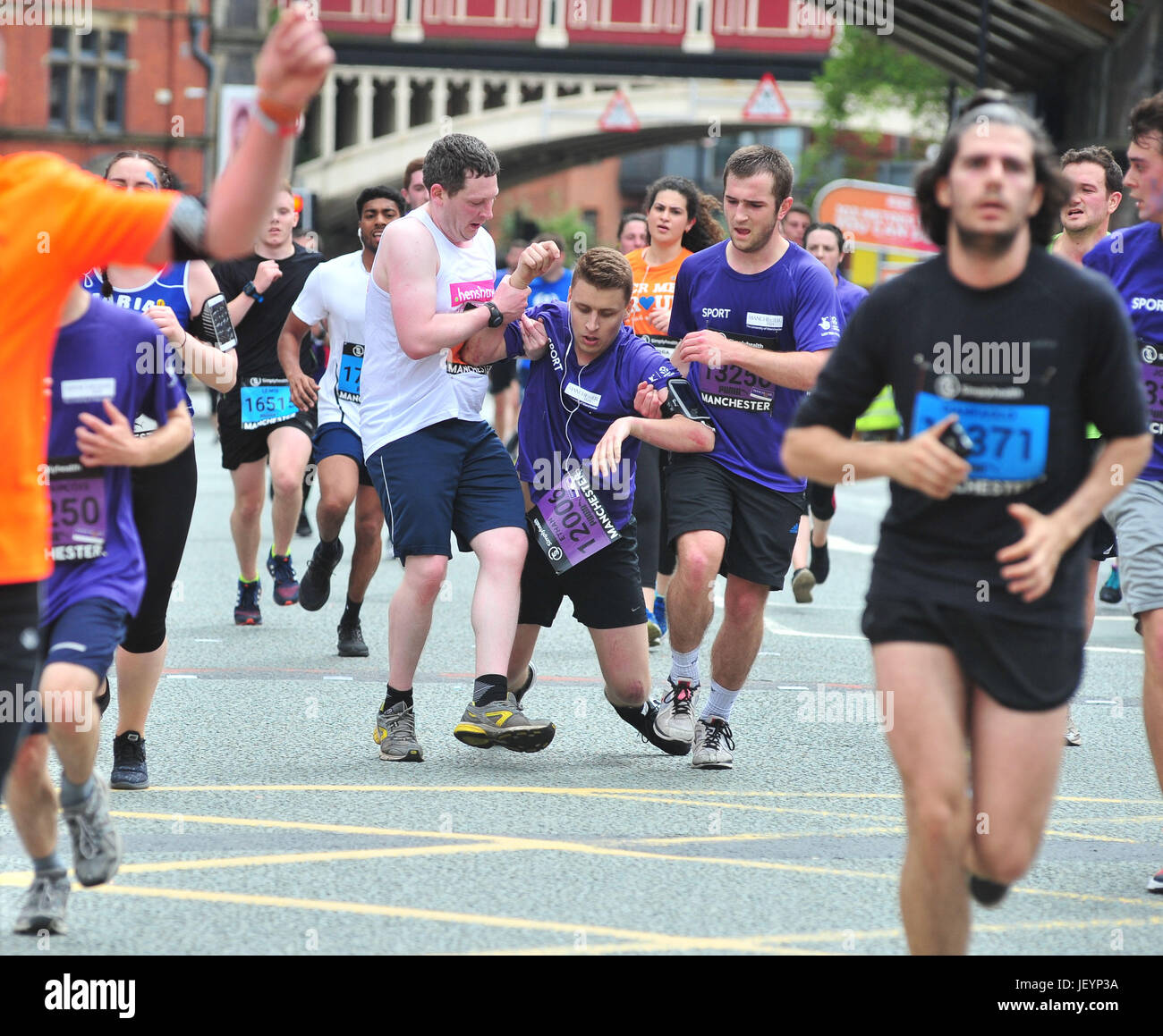 runner are seen finishing the great Manchester run, despite the ...