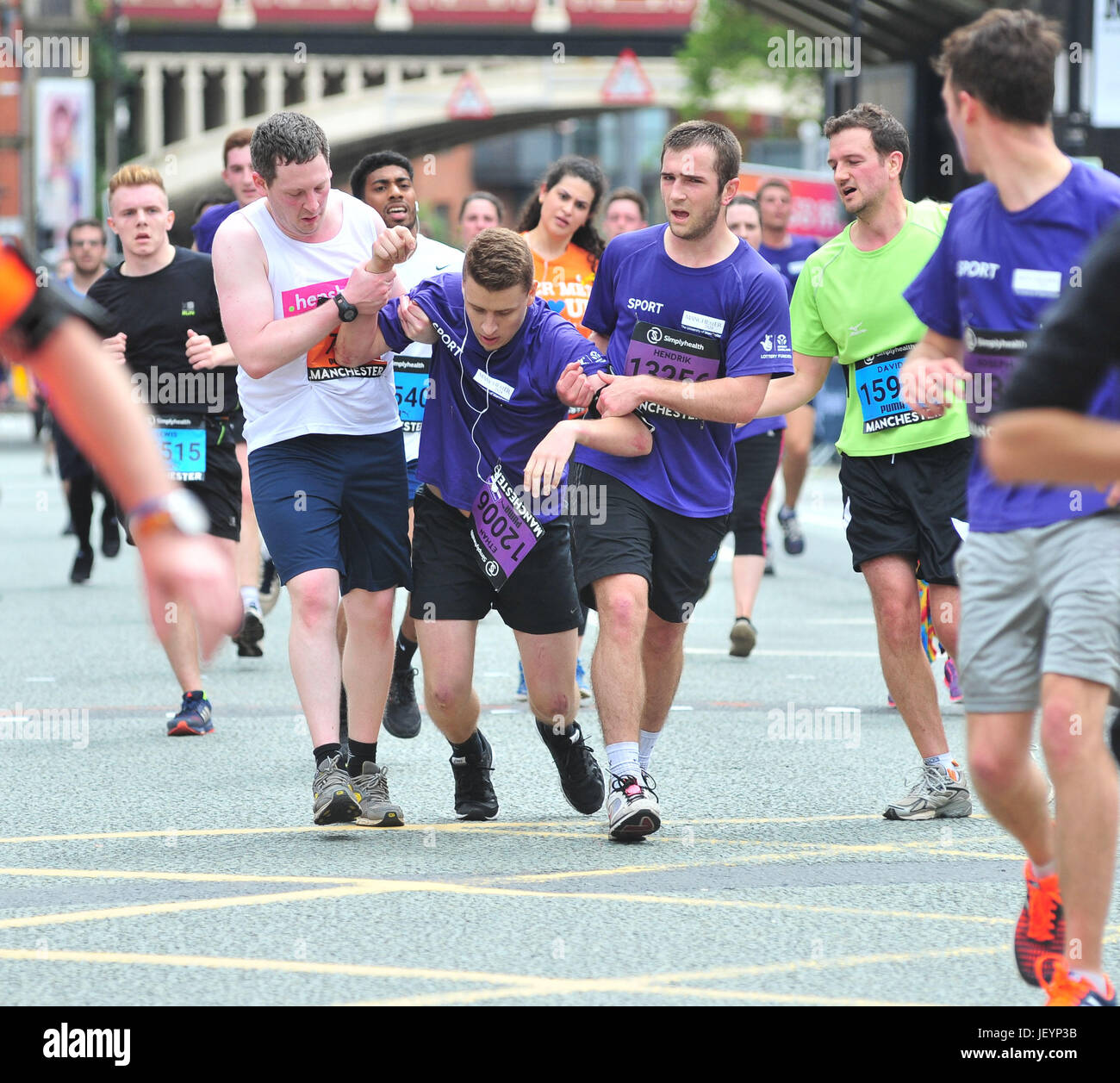 runner are seen finishing the great Manchester run, despite the ...