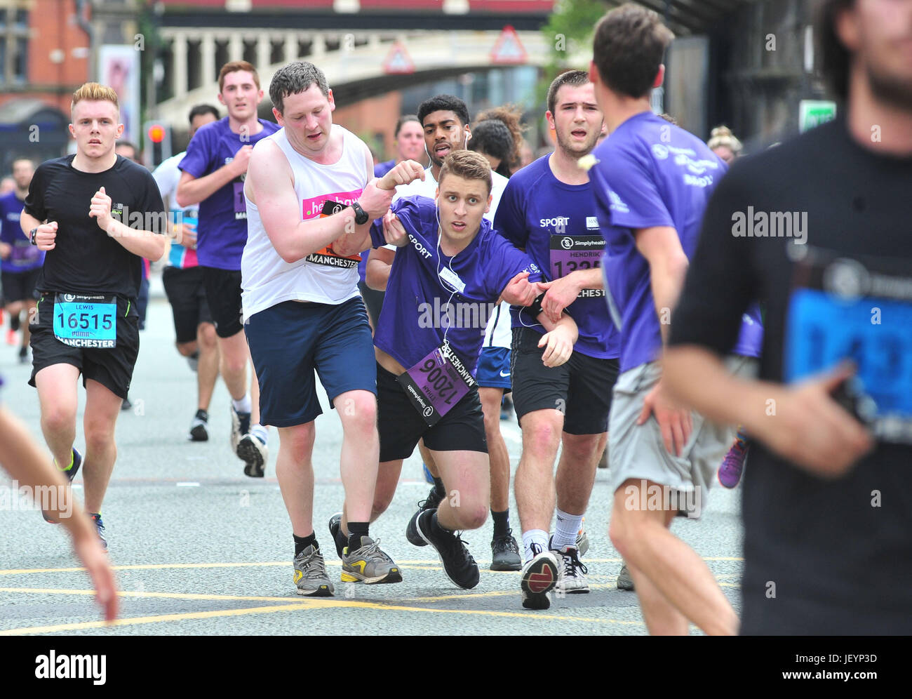 runner are seen finishing the great Manchester run, despite the ...