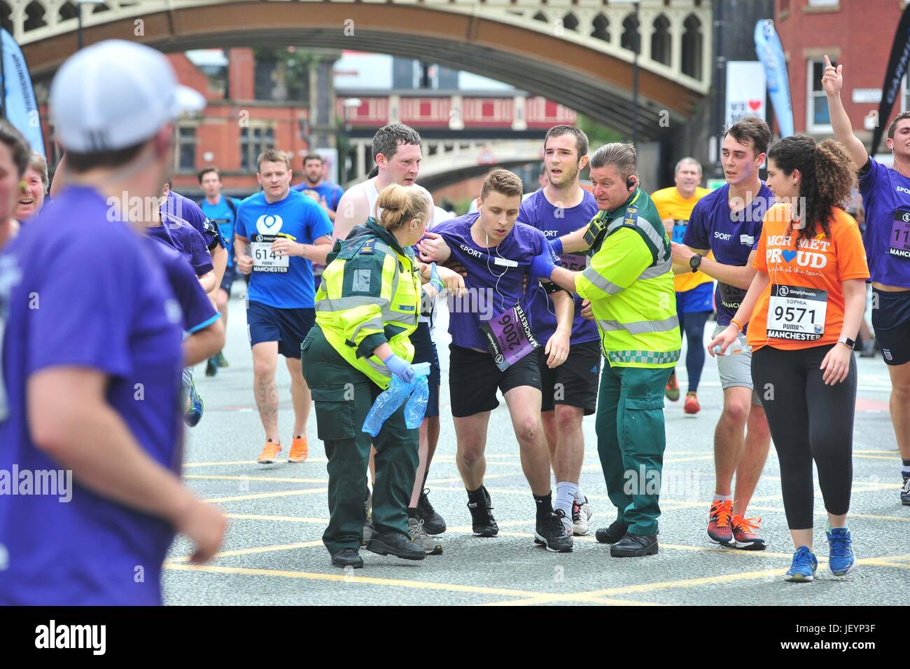 runner are seen finishing the great Manchester run, despite the ...