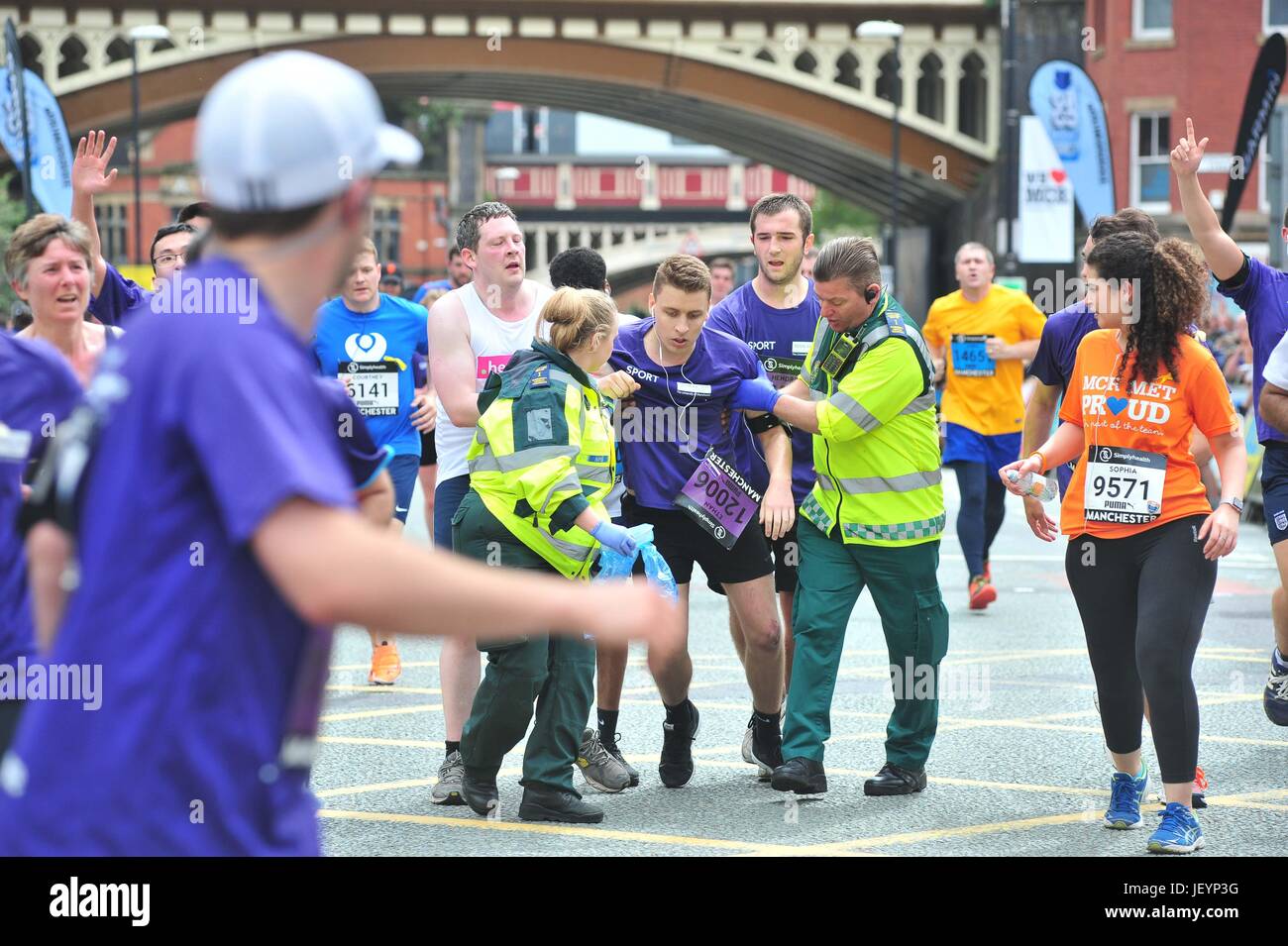 runner are seen finishing the great Manchester run, despite the ...