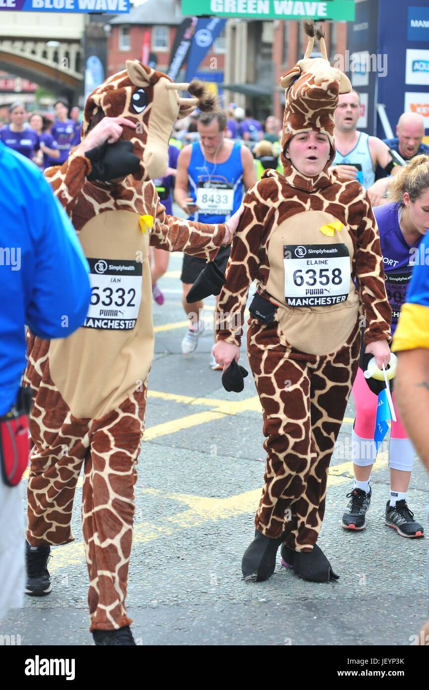 runner are seen finishing the great Manchester run, despite the ...