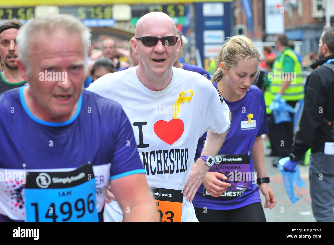 runner are seen finishing the great Manchester run, despite the ...