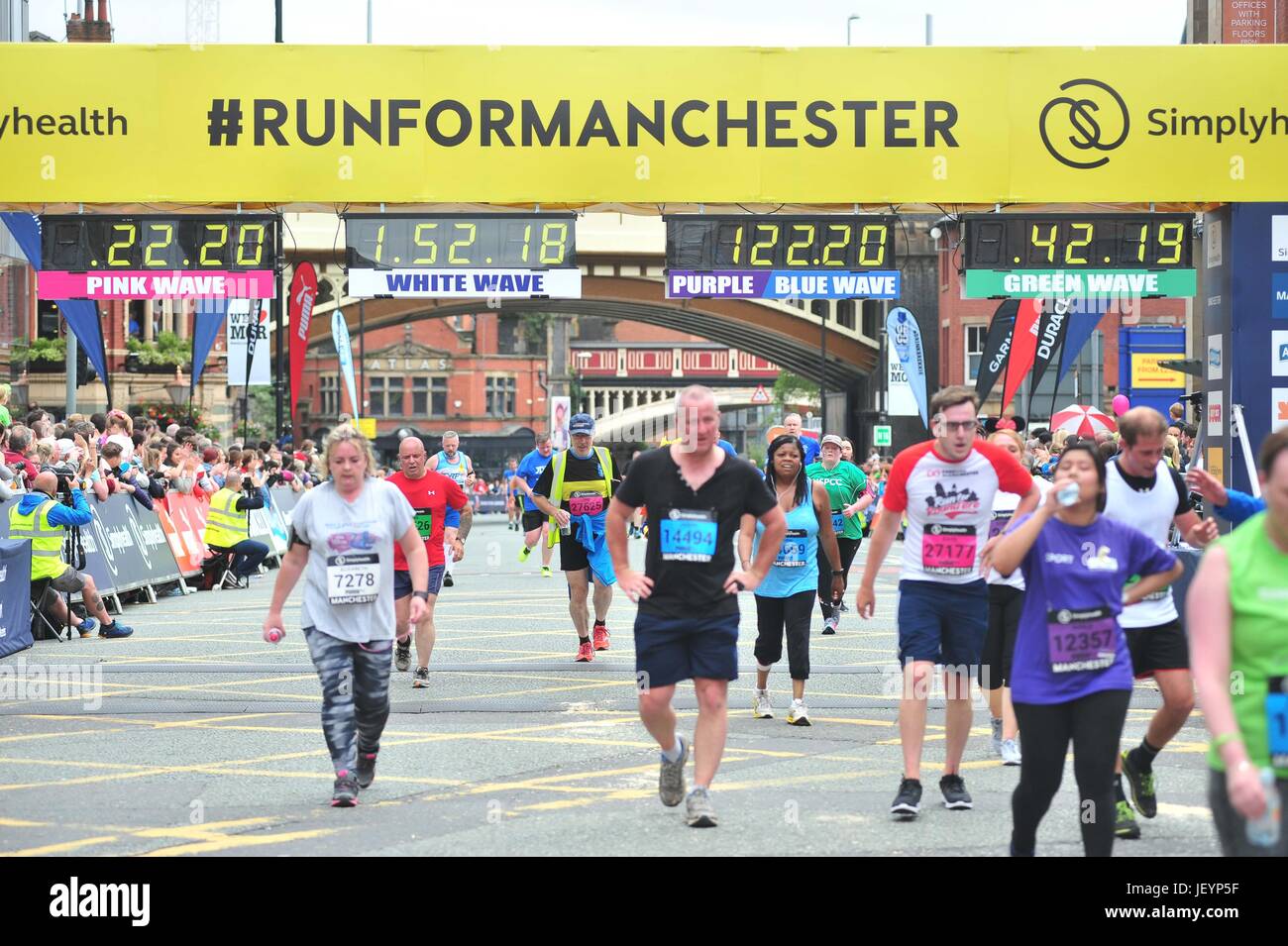 runner are seen finishing the great Manchester run, despite the ...