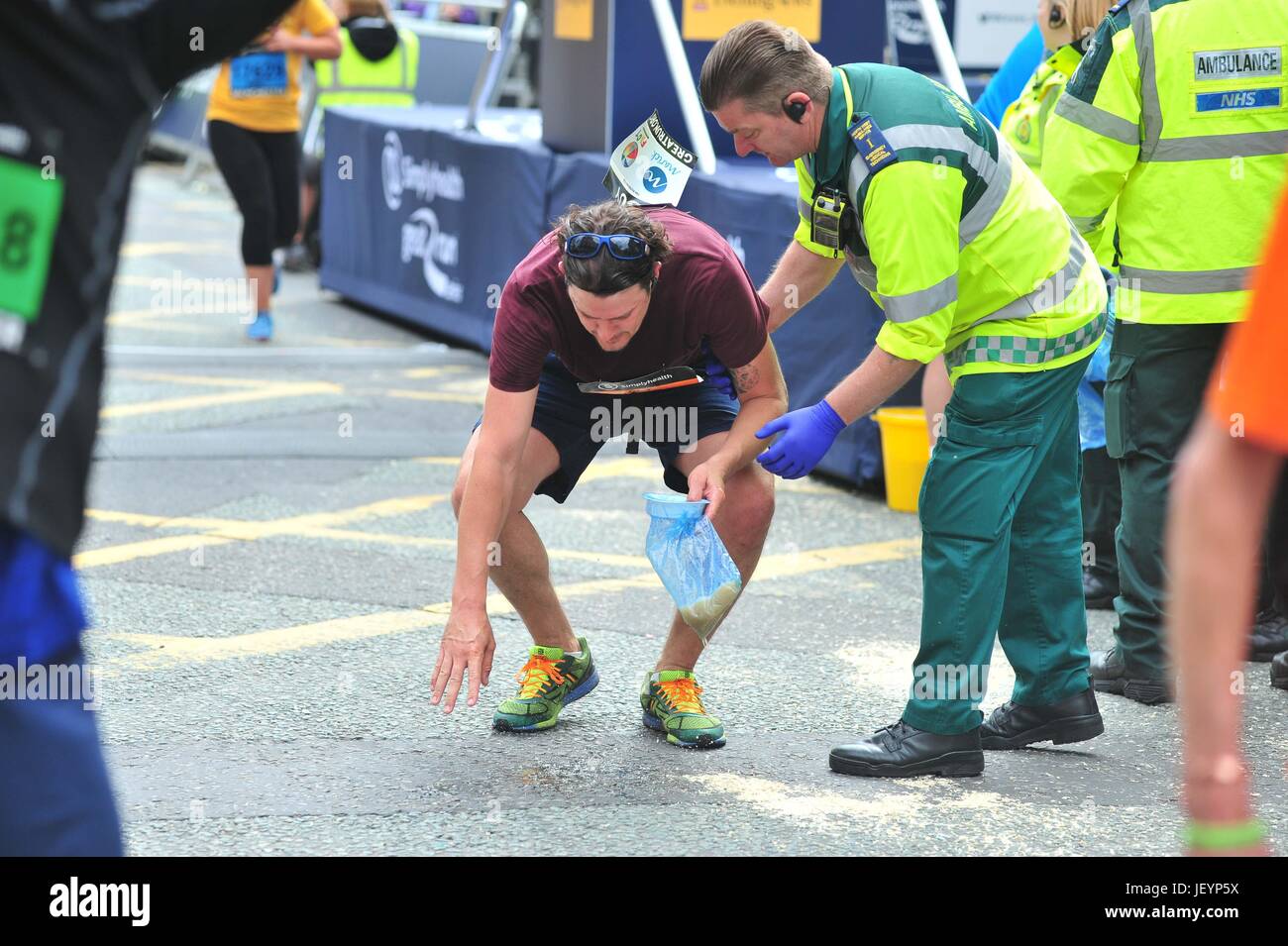 runner are seen finishing the great Manchester run, despite the ...