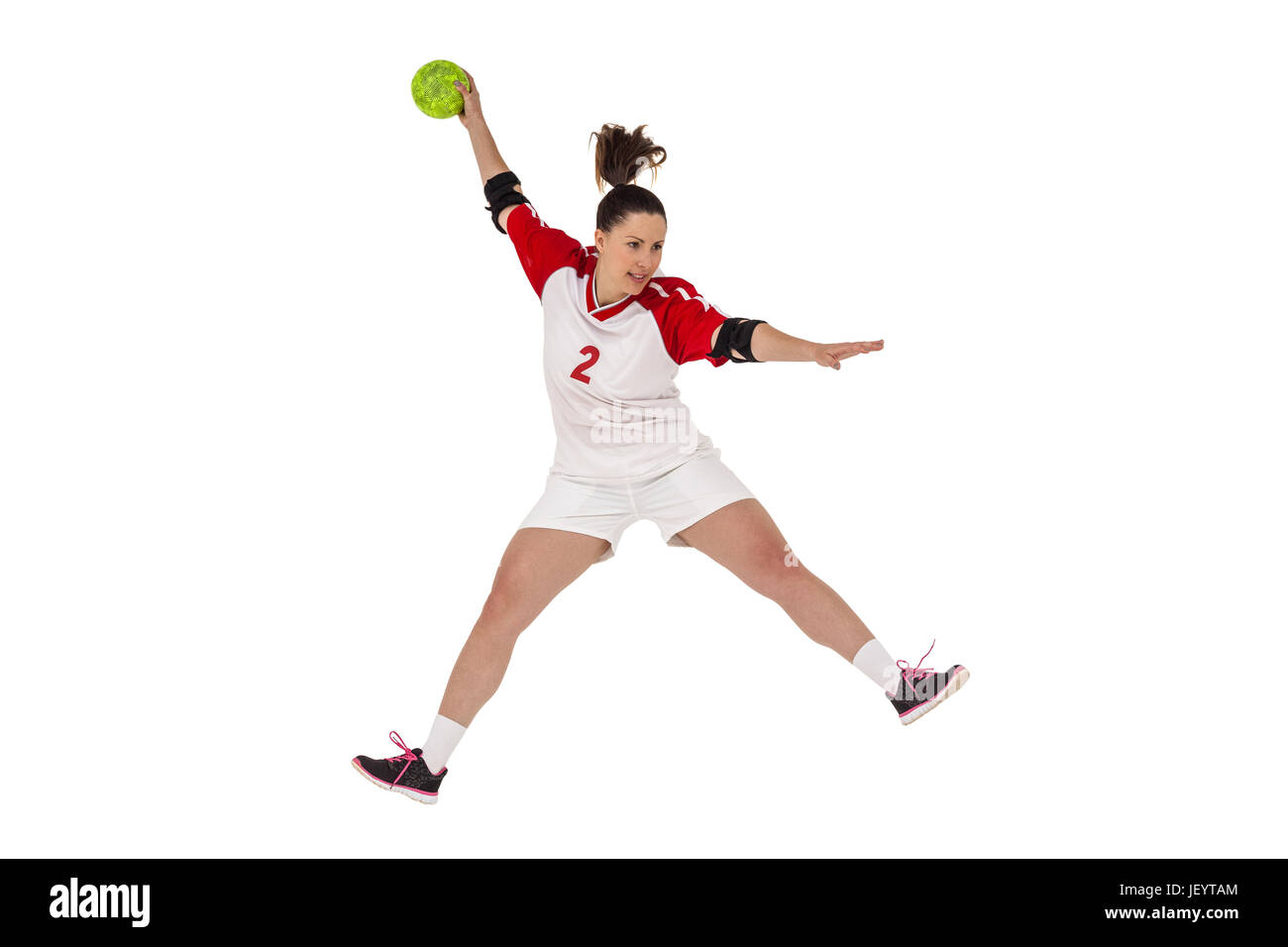 Sportswoman throwing a ball Stock Photo - Alamy