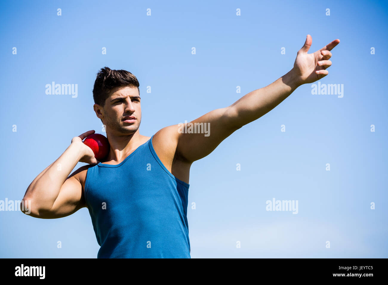 Athlete about to throw shot put ball Stock Photo - Alamy