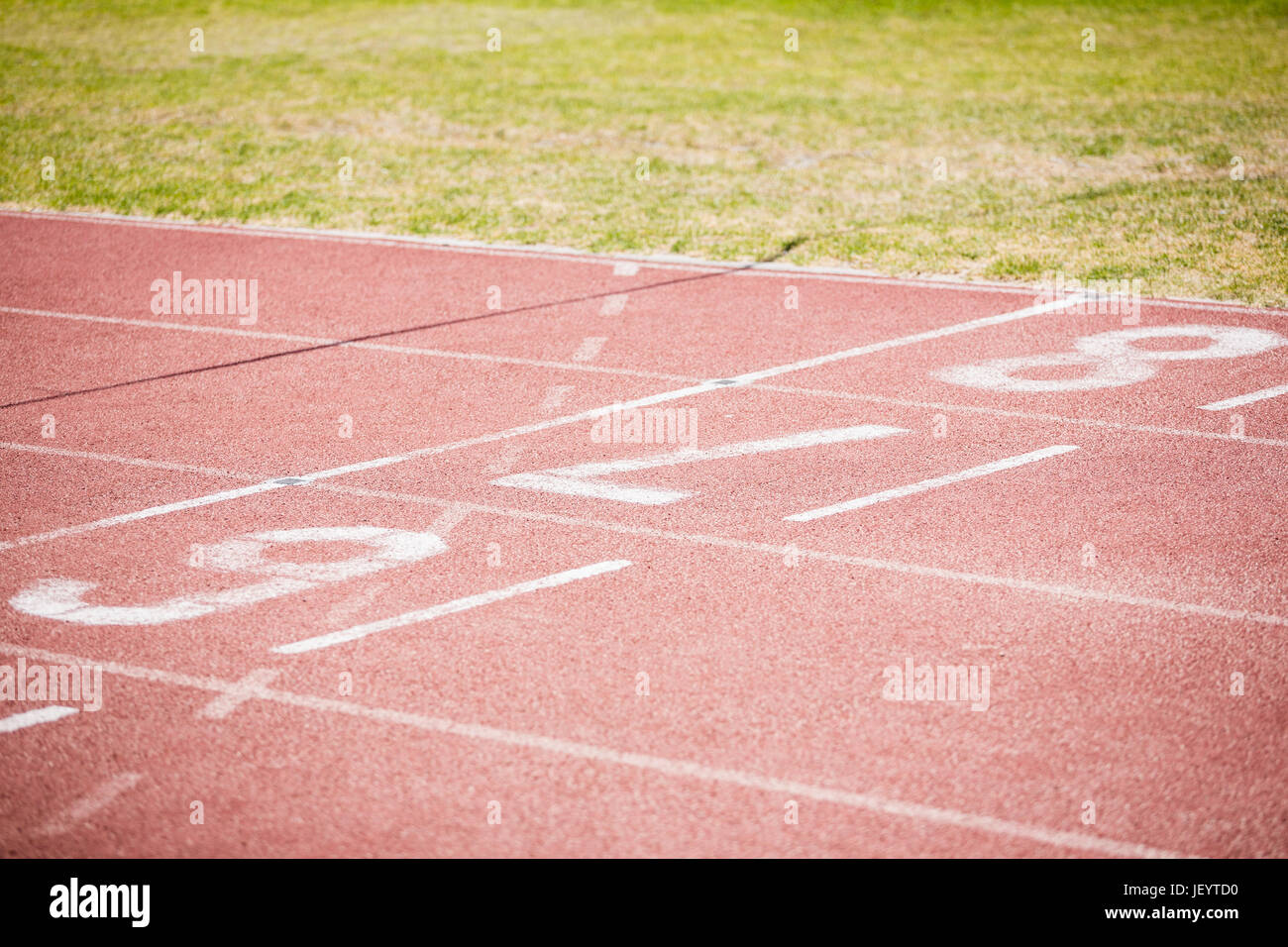 The beginning of the running track Stock Photo - Alamy