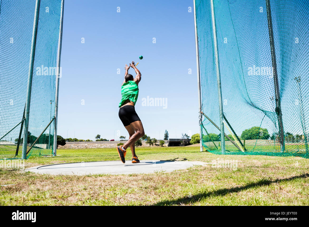 Athlete performing a hammer throw Stock Photo - Alamy
