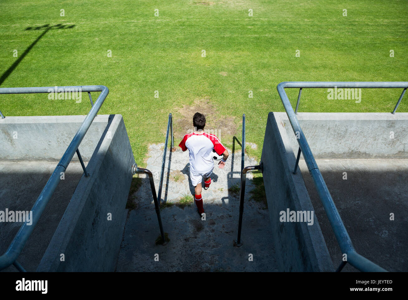 Football player entering the stadium Stock Photo - Alamy