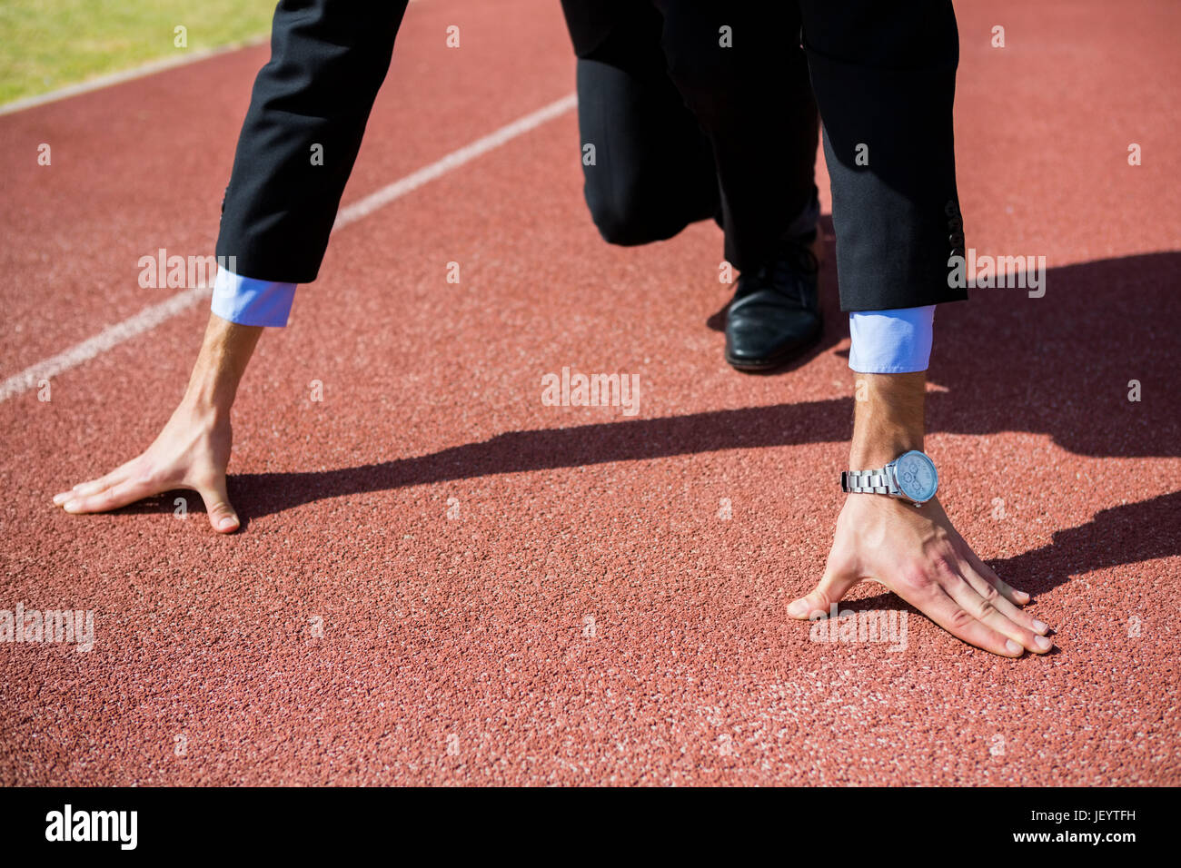 Businessman ready to run Stock Photo - Alamy Businessman ready to run Stock Photo - Alamy