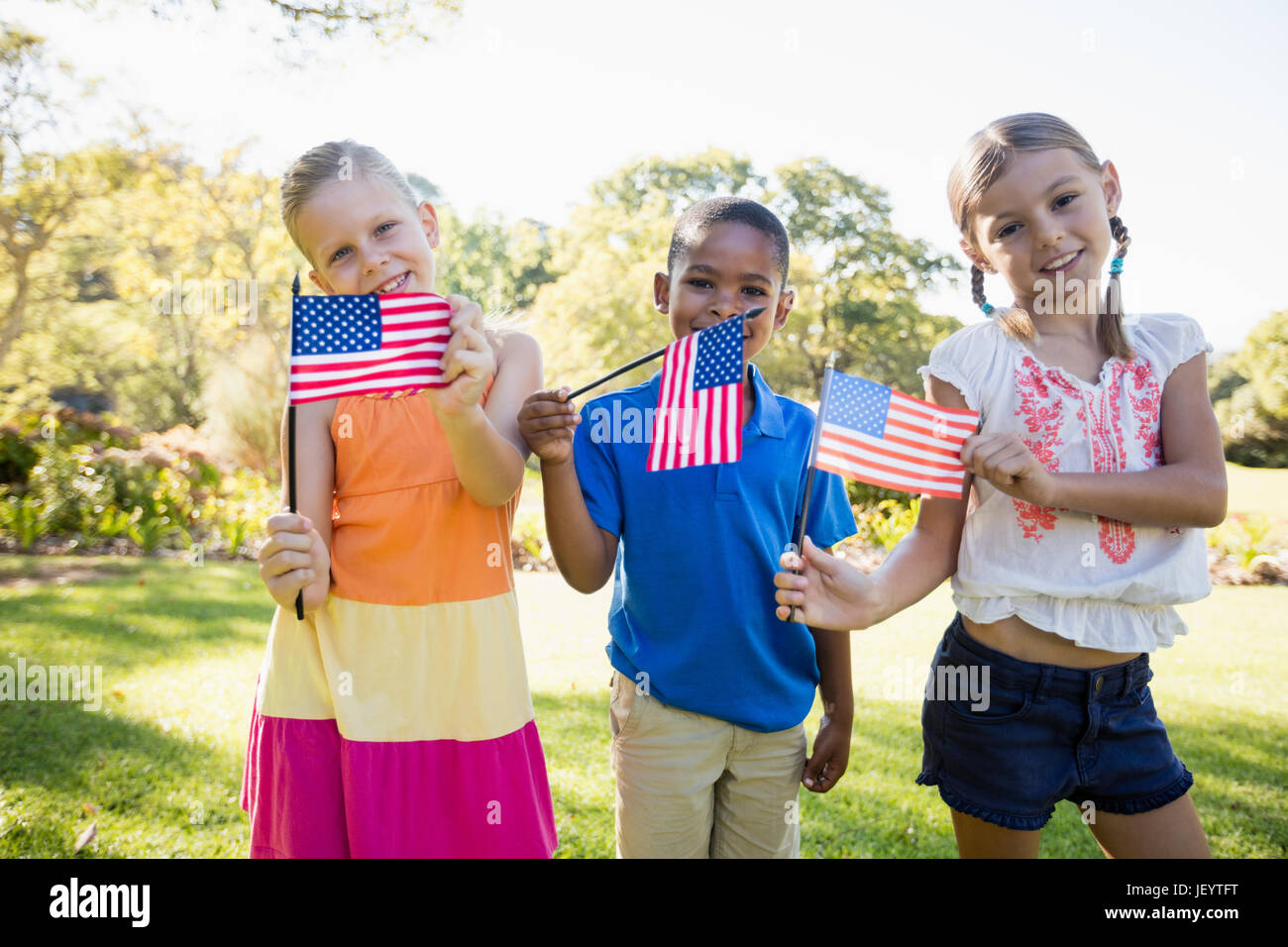 Happy children showing usa flag Stock Photo - Alamy