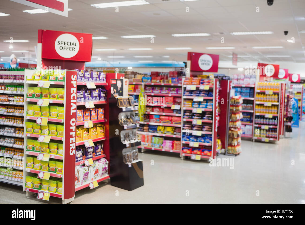 Photograph of shelves with promotions Stock Photo - Alamy