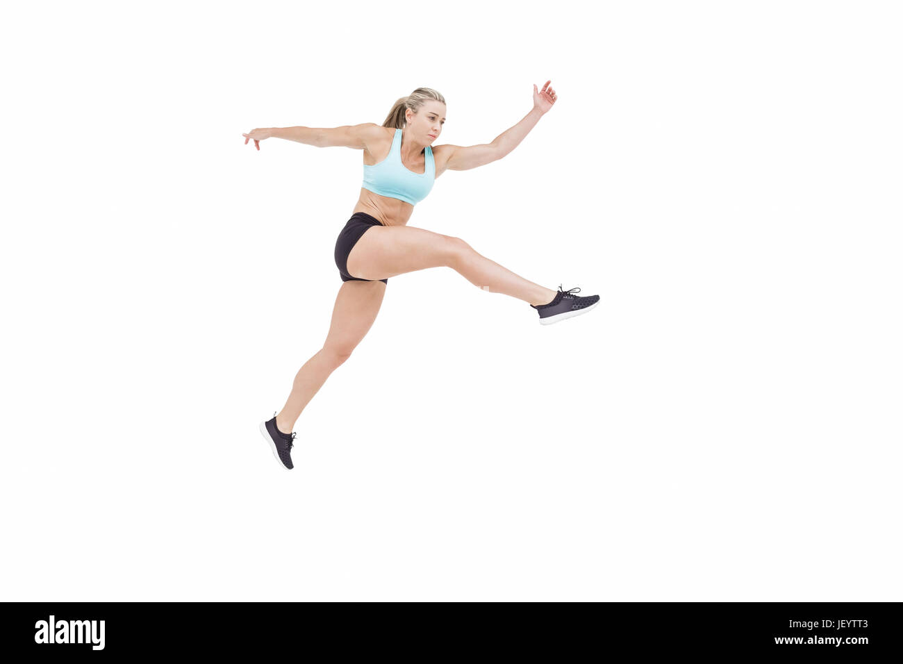 Female athlete jumping Stock Photo - Alamy