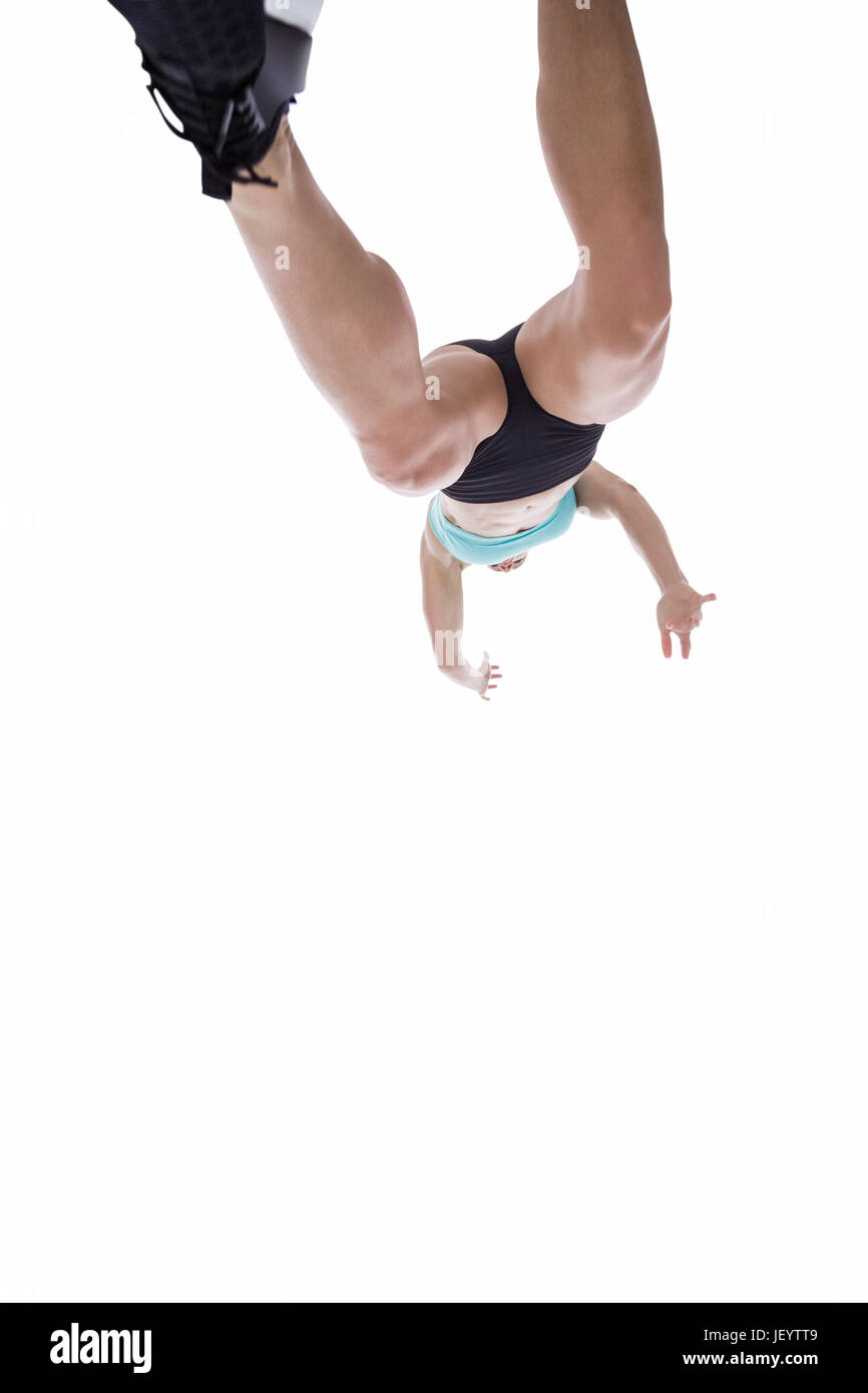 Low angle female athlete jumping Stock Photo - Alamy