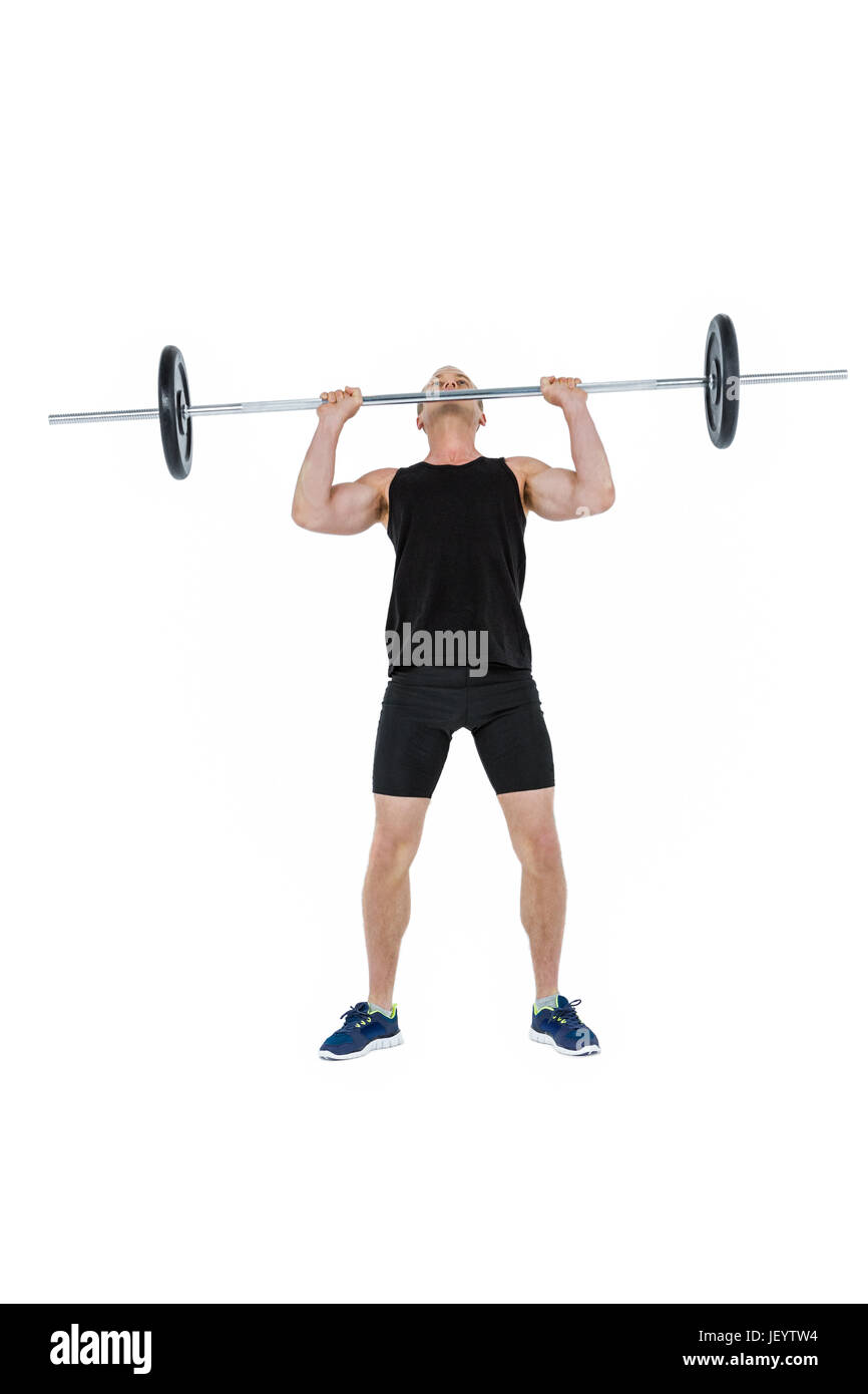 Bodybuilder lifting heavy barbell weights Stock Photo - Alamy