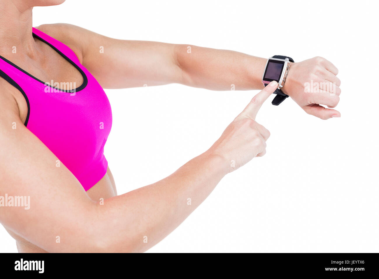Female athlete using her smart watch Stock Photo - Alamy