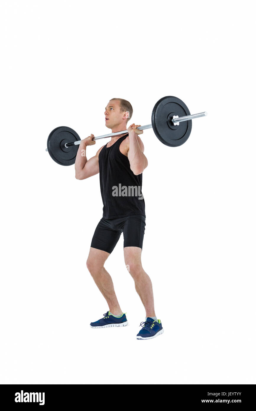 Bodybuilder lifting heavy barbell weights Stock Photo - Alamy