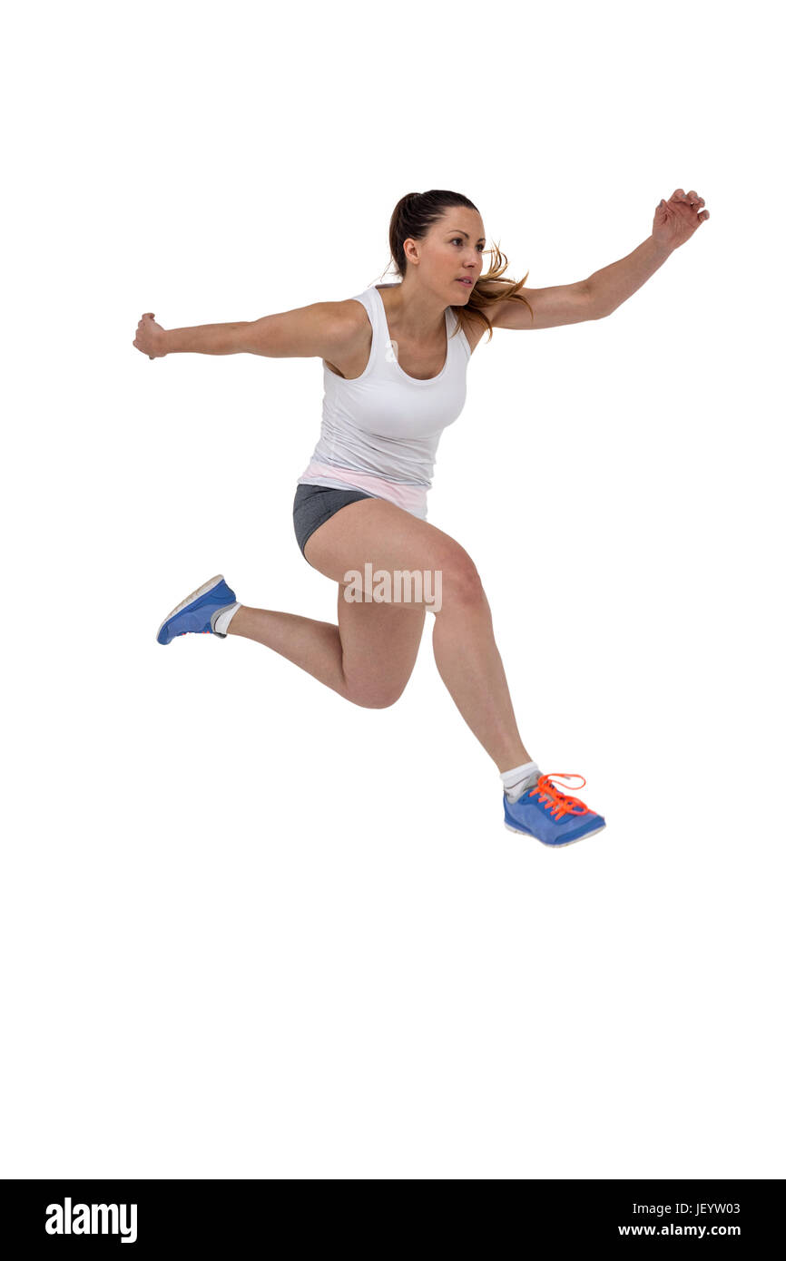 Athletic woman running on white background Stock Photo - Alamy