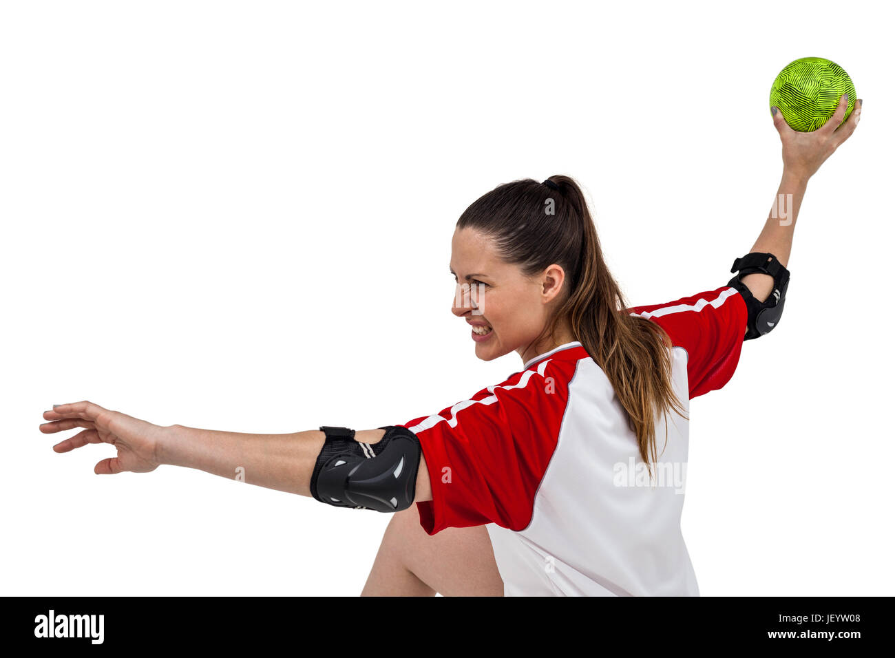Sportswoman throwing a ball Stock Photo - Alamy
