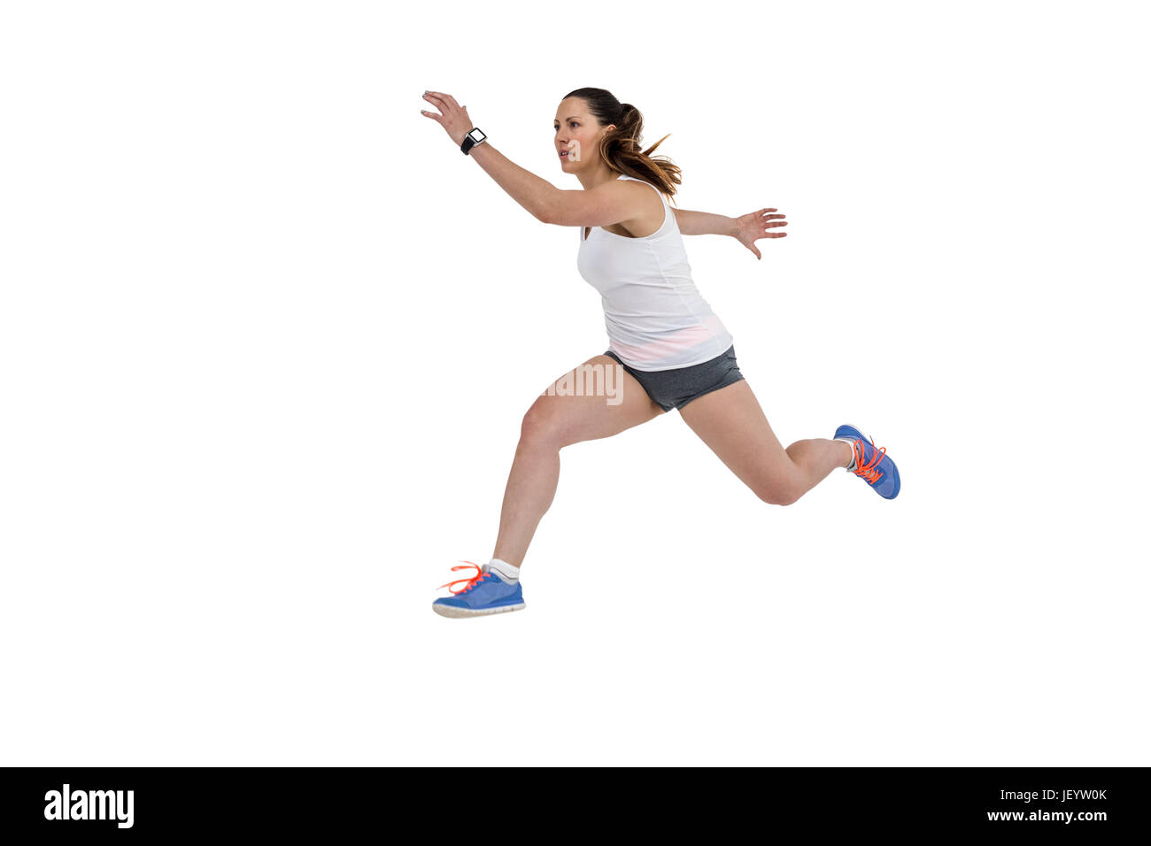 Athletic woman running on white background Stock Photo - Alamy