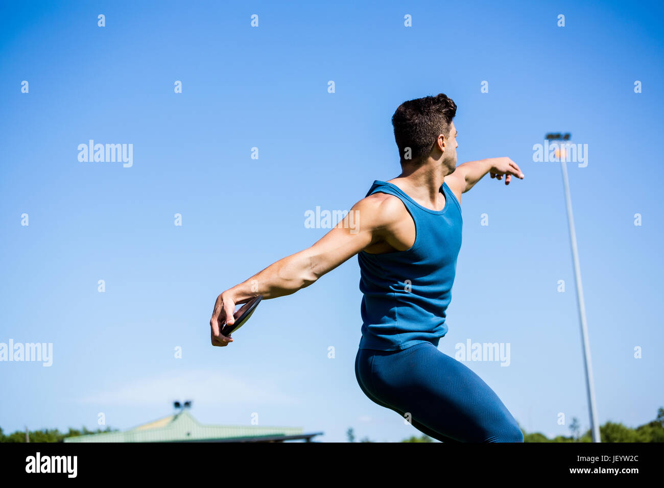Athlete about to throw a discus Stock Photo - Alamy