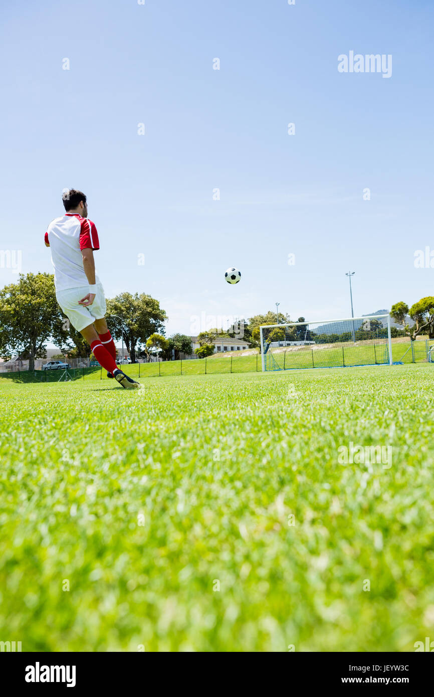 Football player practicing soccer Stock Photo - Alamy
