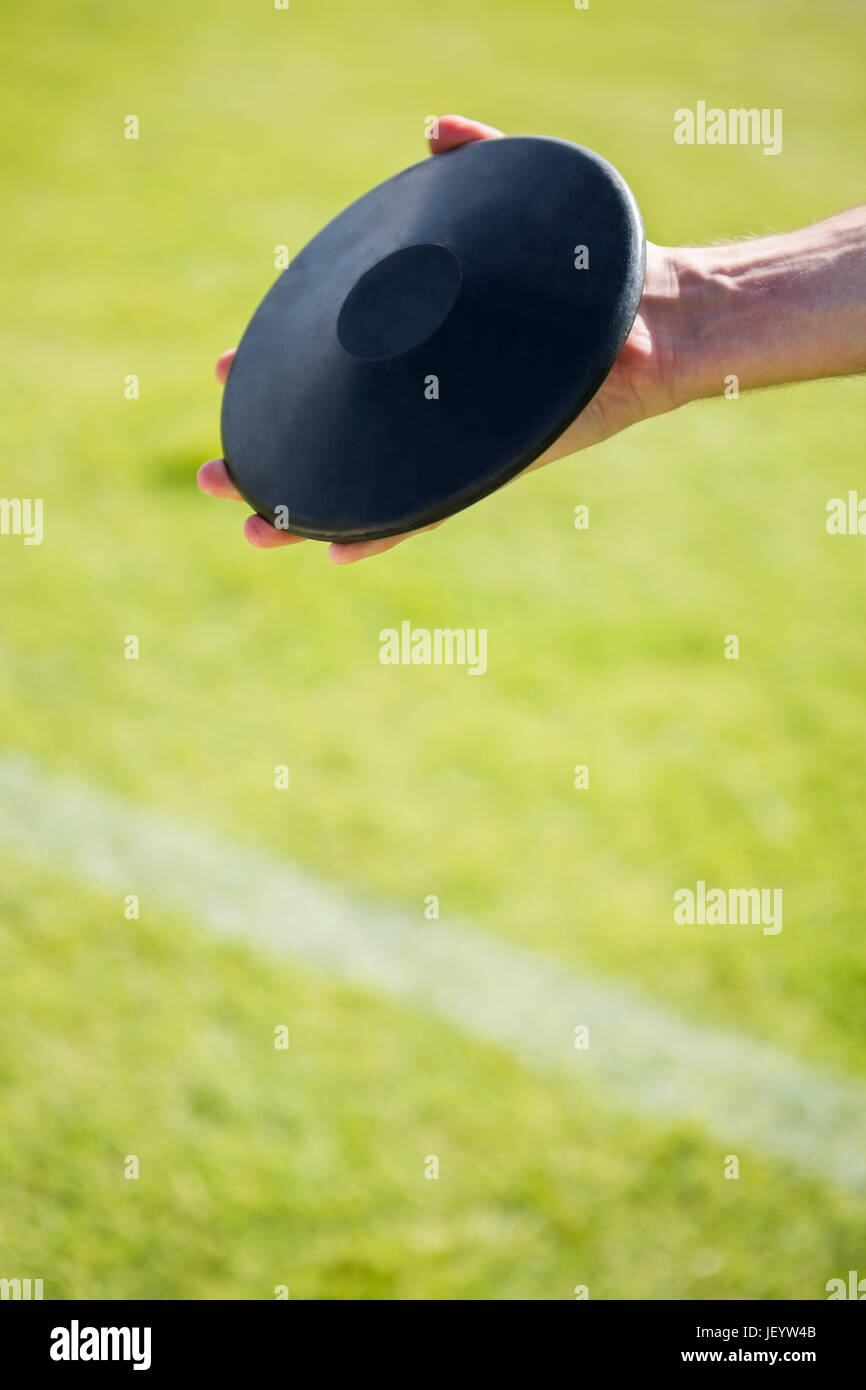 Close-up of hand holding a discus Stock Photo - Alamy