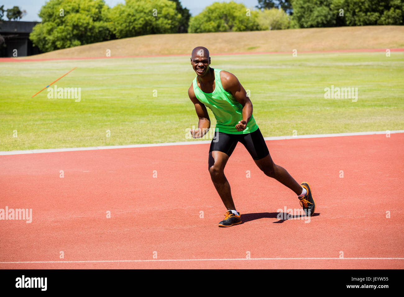 Portrait of a happy athlete posing Stock Photo - Alamy