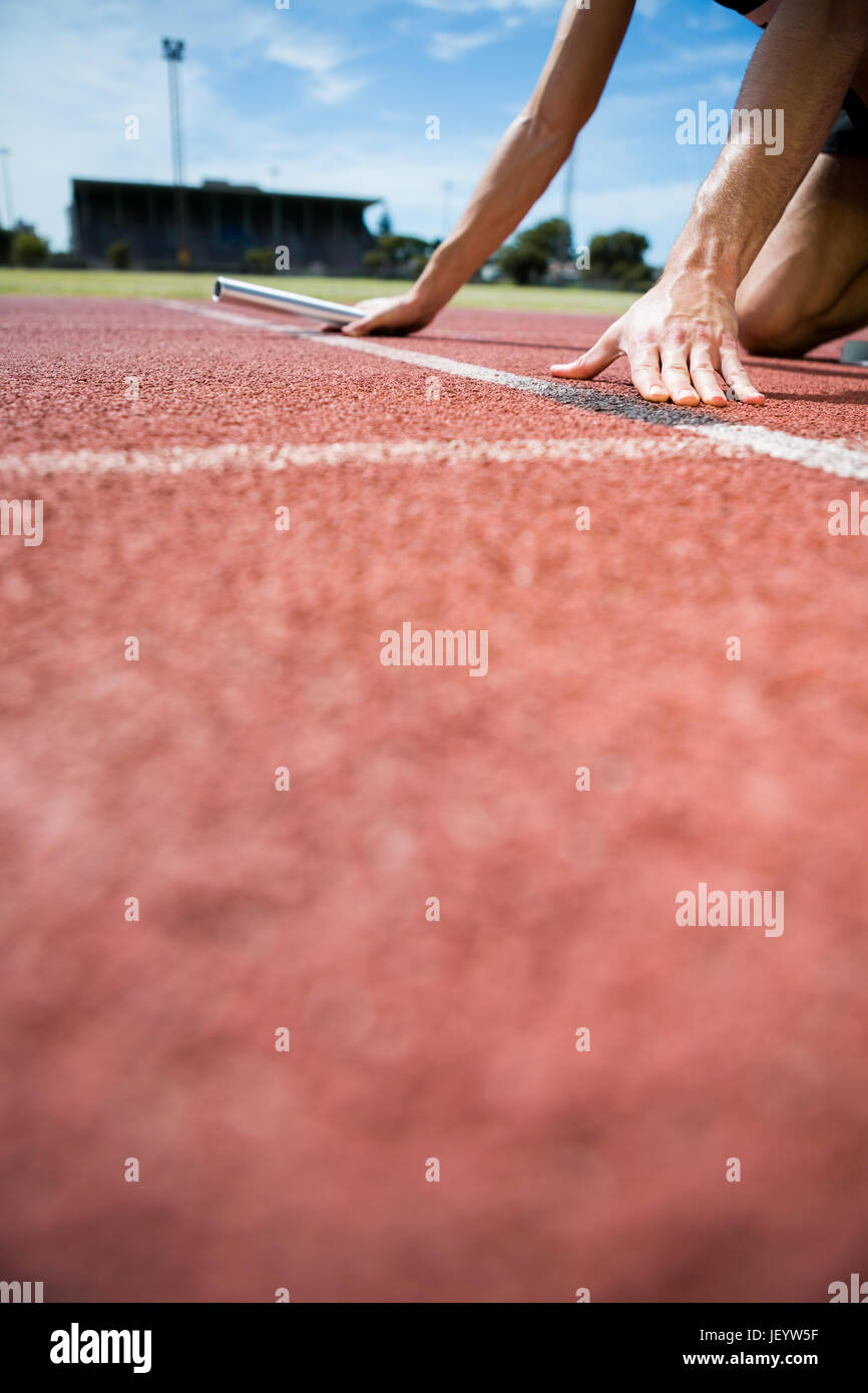 Athlete ready to start the relay race Stock Photo - Alamy