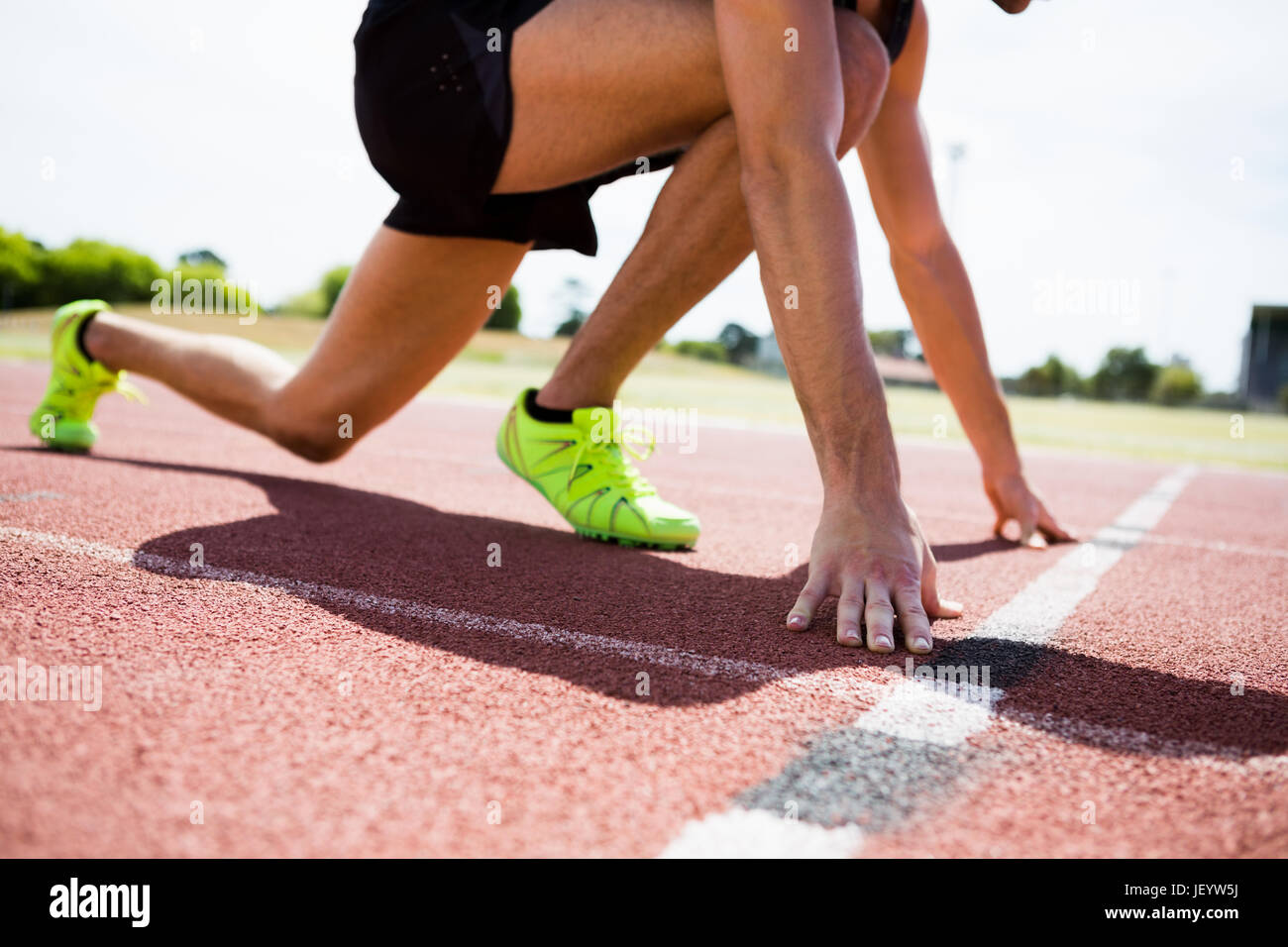 Athlete ready to run Stock Photo - Alamy